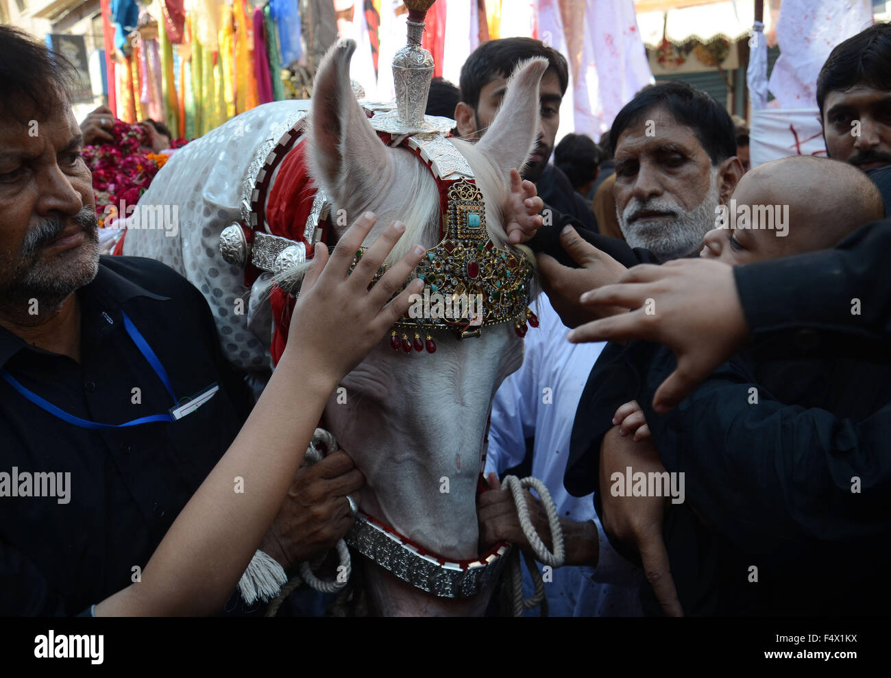 Lahore, Pakistan. 23rd Oct, 2015. Pakistani Shiite Muslim devotees take ...