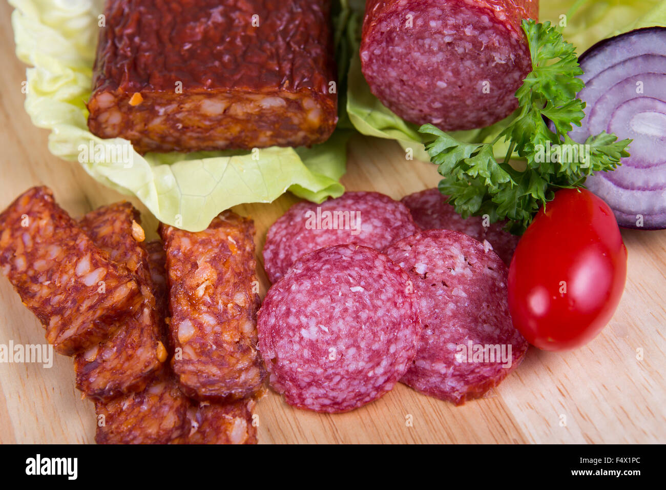 Sausage of salami on a cutting board Stock Photo - Alamy