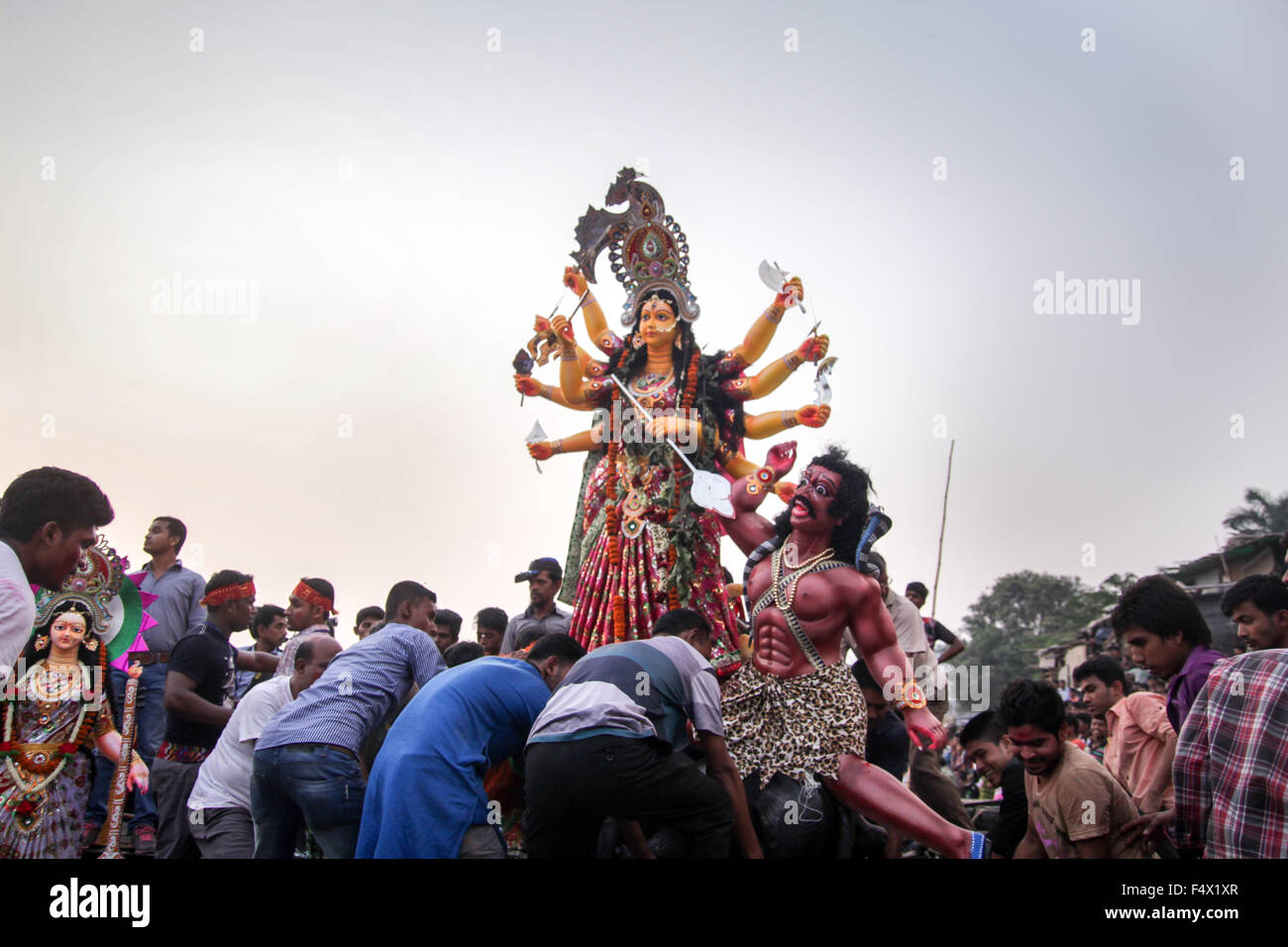 Bangladeshi Hindu religious people performing immersion of Goddess ...