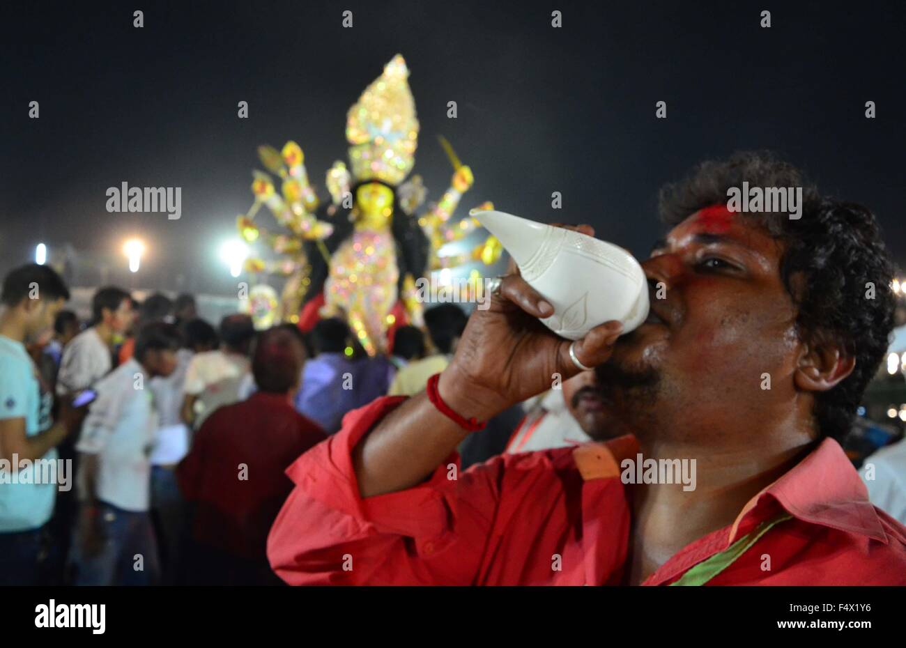 An Indian Hindu Devotee blow conch sheel during take part in Immersion ...