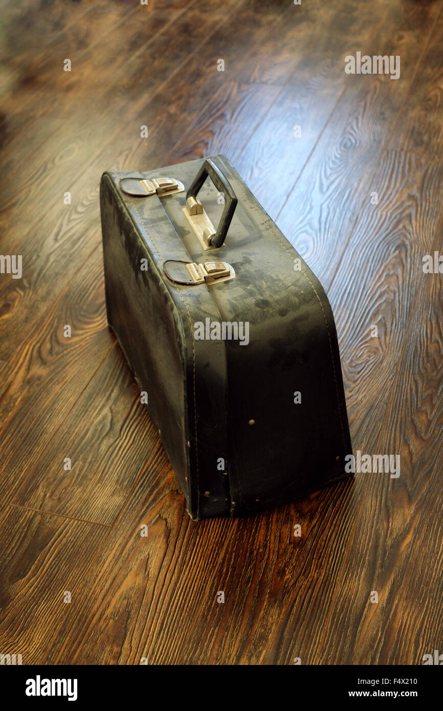 Old dirty bag on a brown timber floor Stock Photo - Alamy