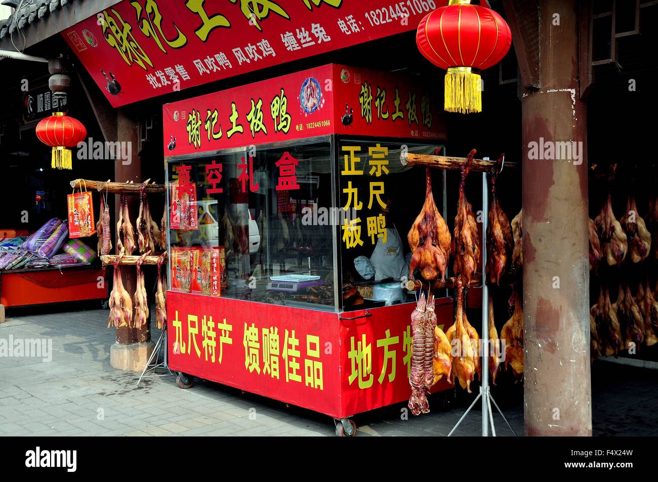 Jun Le, China: Portable food booth on wheels selling pressed ducks, a ...