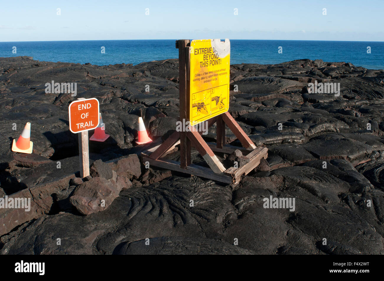 End of trail. Black lava mountains near the coast and highway Chain of ...
