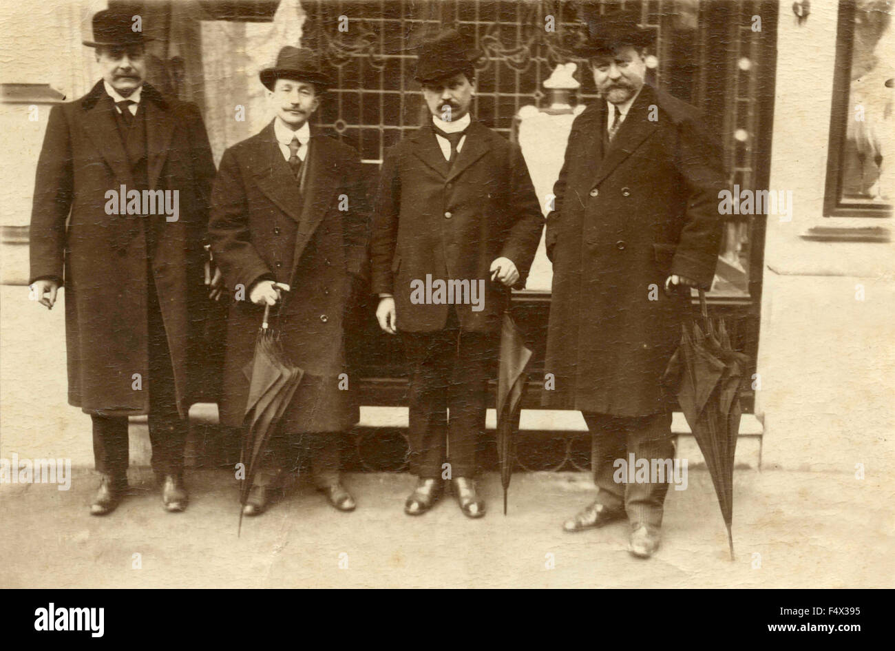 Four men in the street, Italy Stock Photo - Alamy