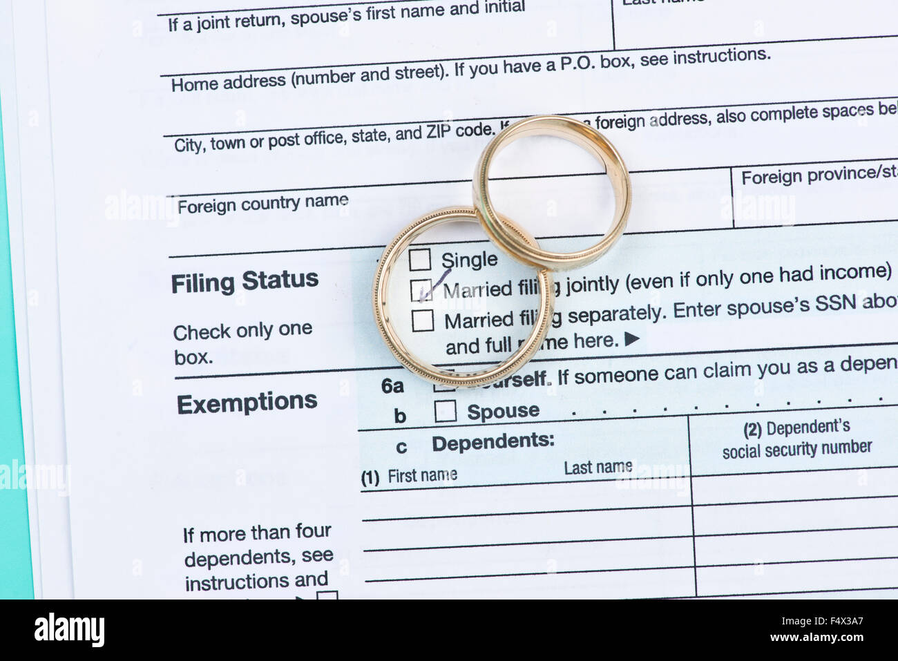 Wedding rings with United States tax form 1040 Stock Photo - Alamy