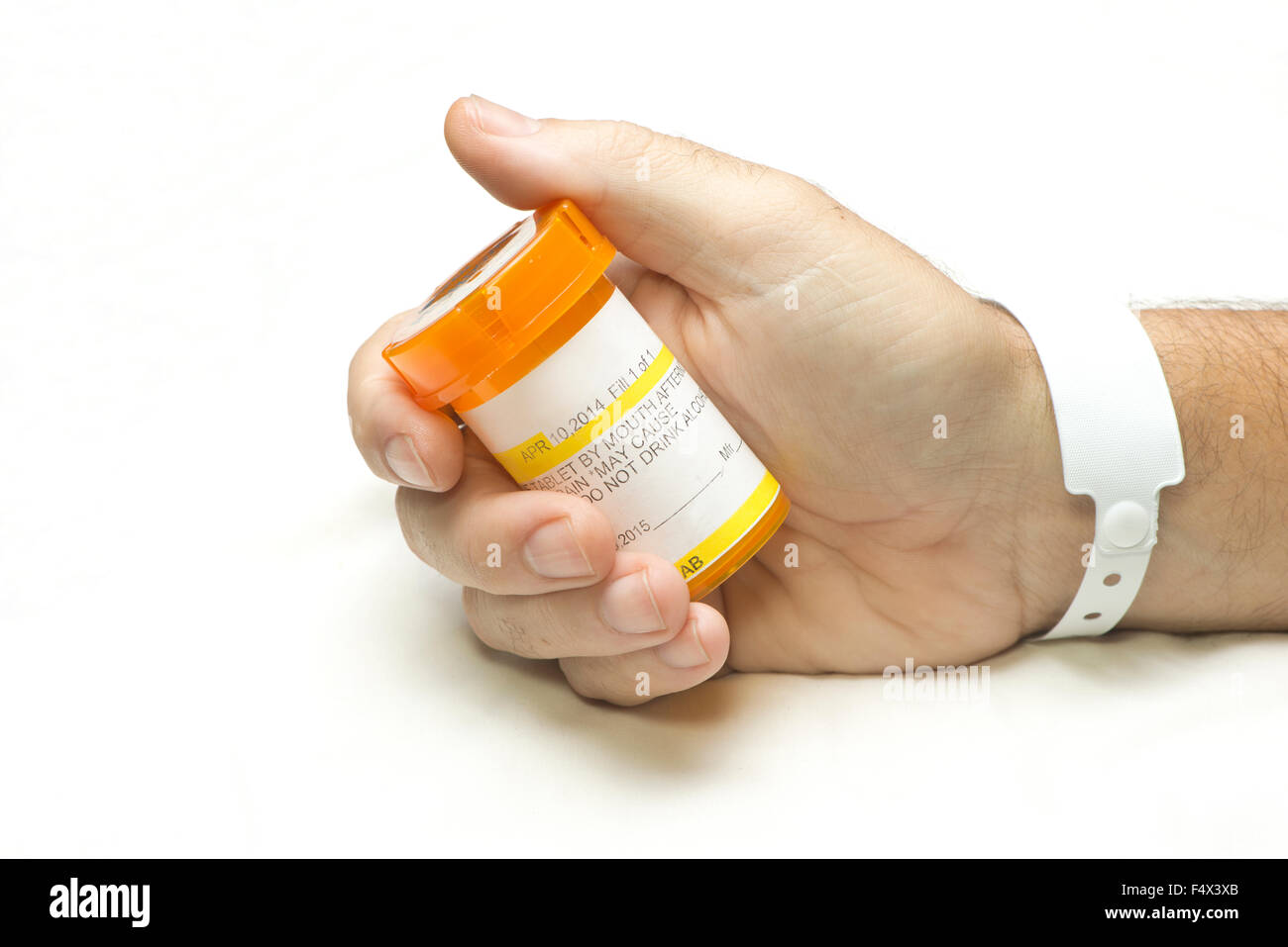 Prescription medication bottle in hospital patient's hand Stock Photo ...