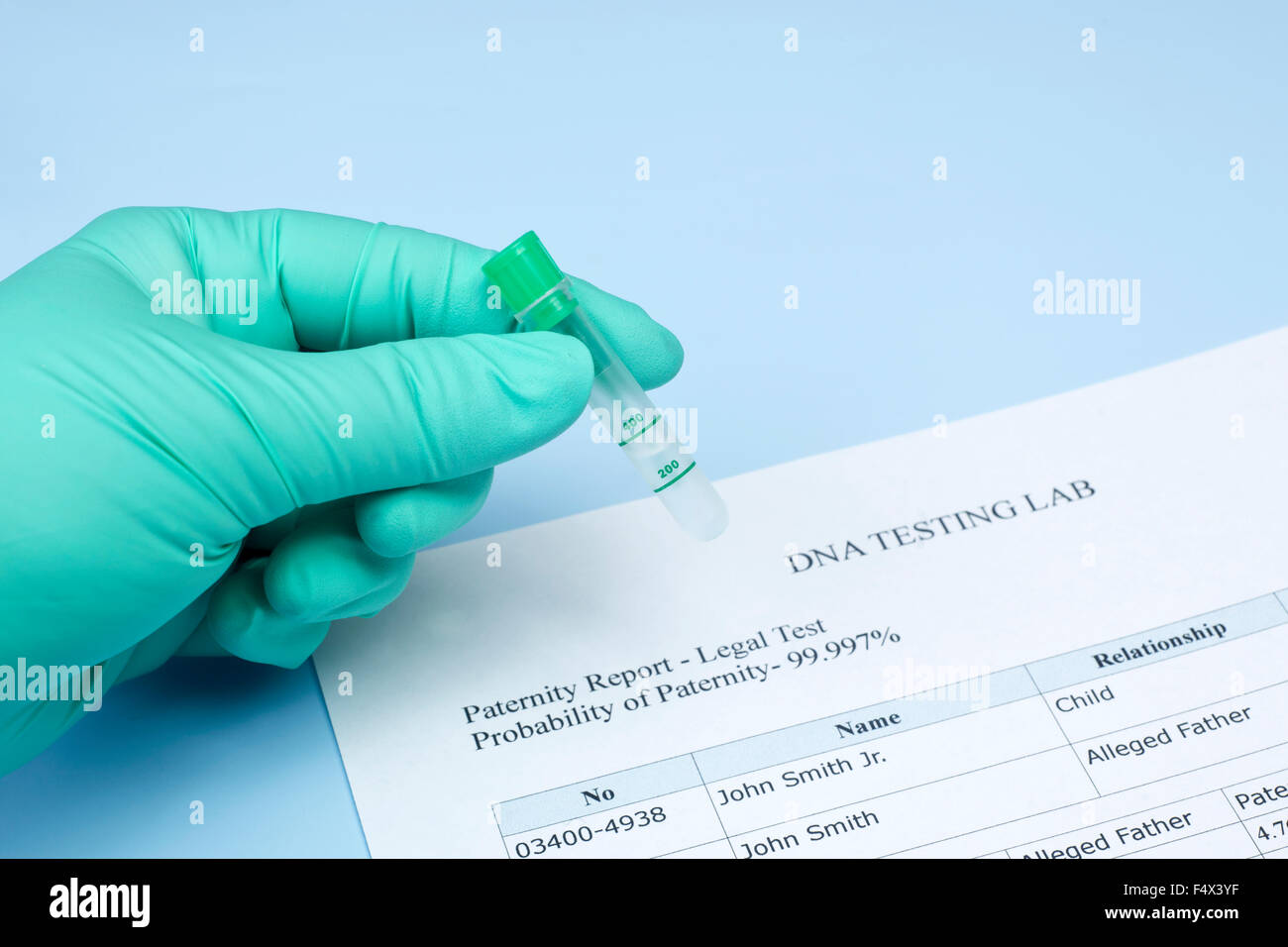 Paternity test results with technician holding lab sample Stock Photo ...