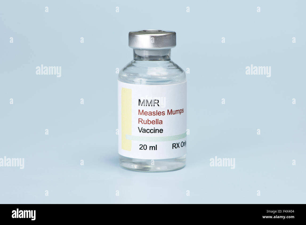 Measles, mumps, rubella, virus vaccine vial on blue background Stock ...