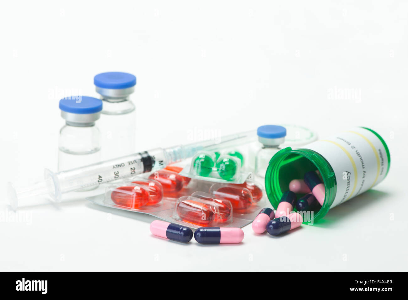 Various cold medications with prescription bottle and syringe Stock ...