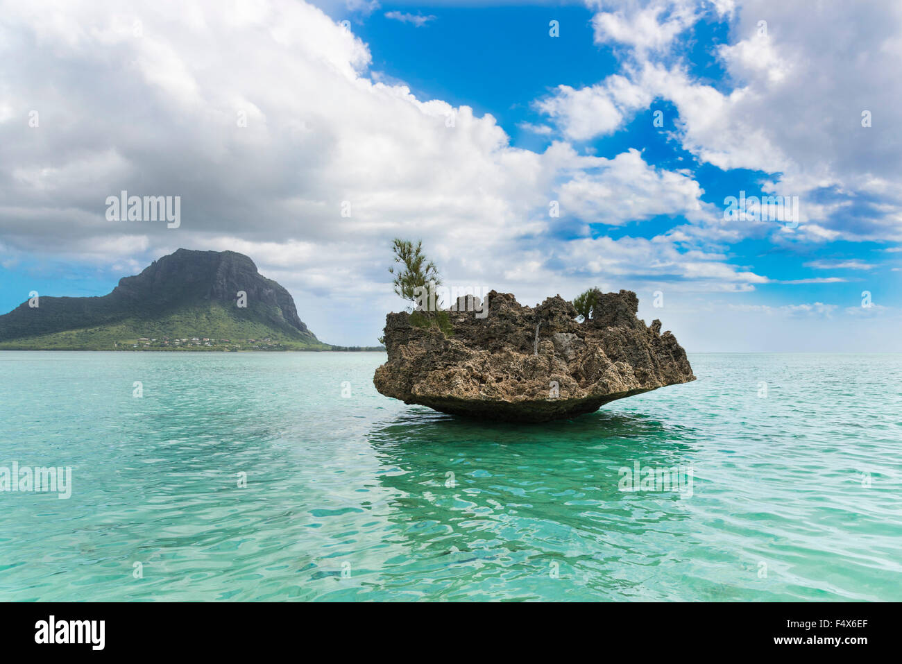 Coral rock island off the shores of Mauritius with Le Morne mountain in ...