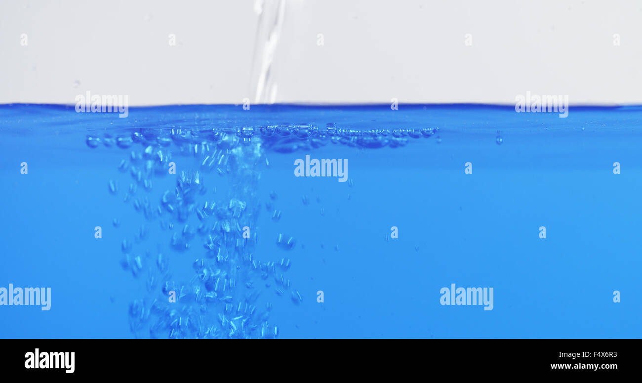 blue water pouring in aquarium Stock Photo - Alamy