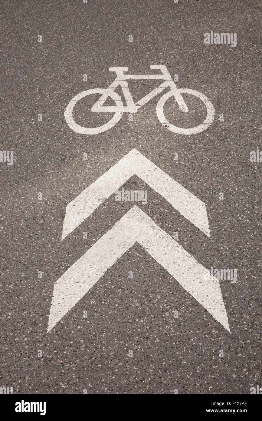 Bike Lane Sign on Pavement Stock Photo - Alamy