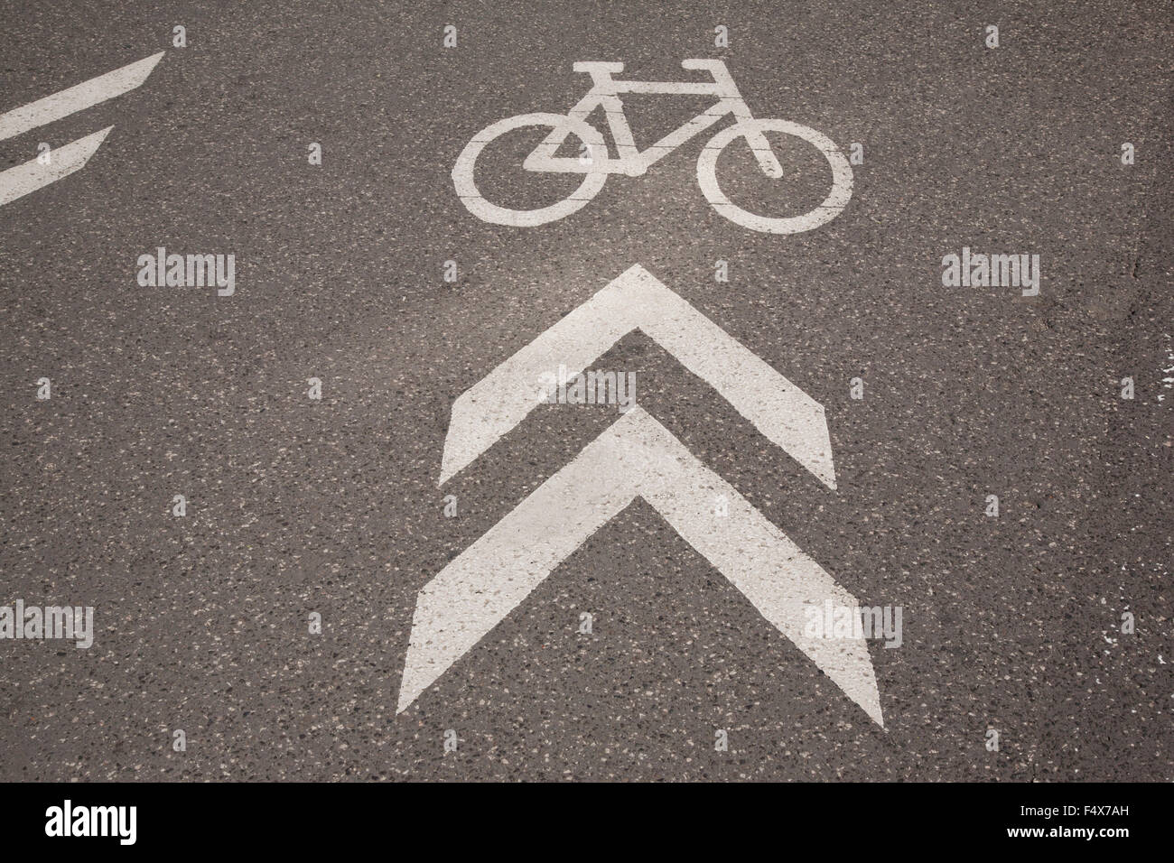 Bike Lane Sign on Pavement Stock Photo - Alamy