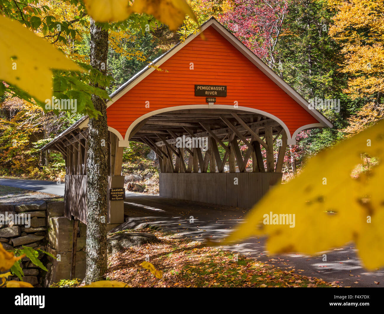Entrance to red covered bridge in Fanconia New Hampshire during Fall ...