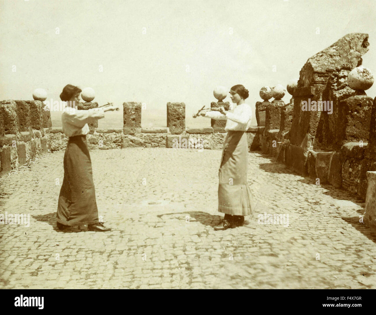 Two girls play to pull a circle, Italy Stock Photo - Alamy
