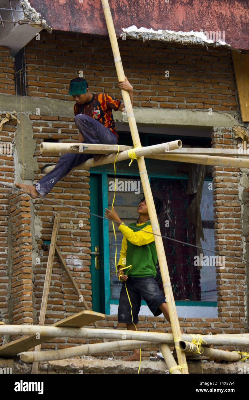 SULAWESI, INDONESIA - JULY 2 2012: Indonesian workers in a construction ...