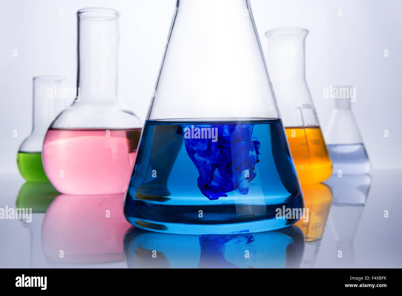 chemistry laboratory equipment and blue drop in the liquid in the flask ...