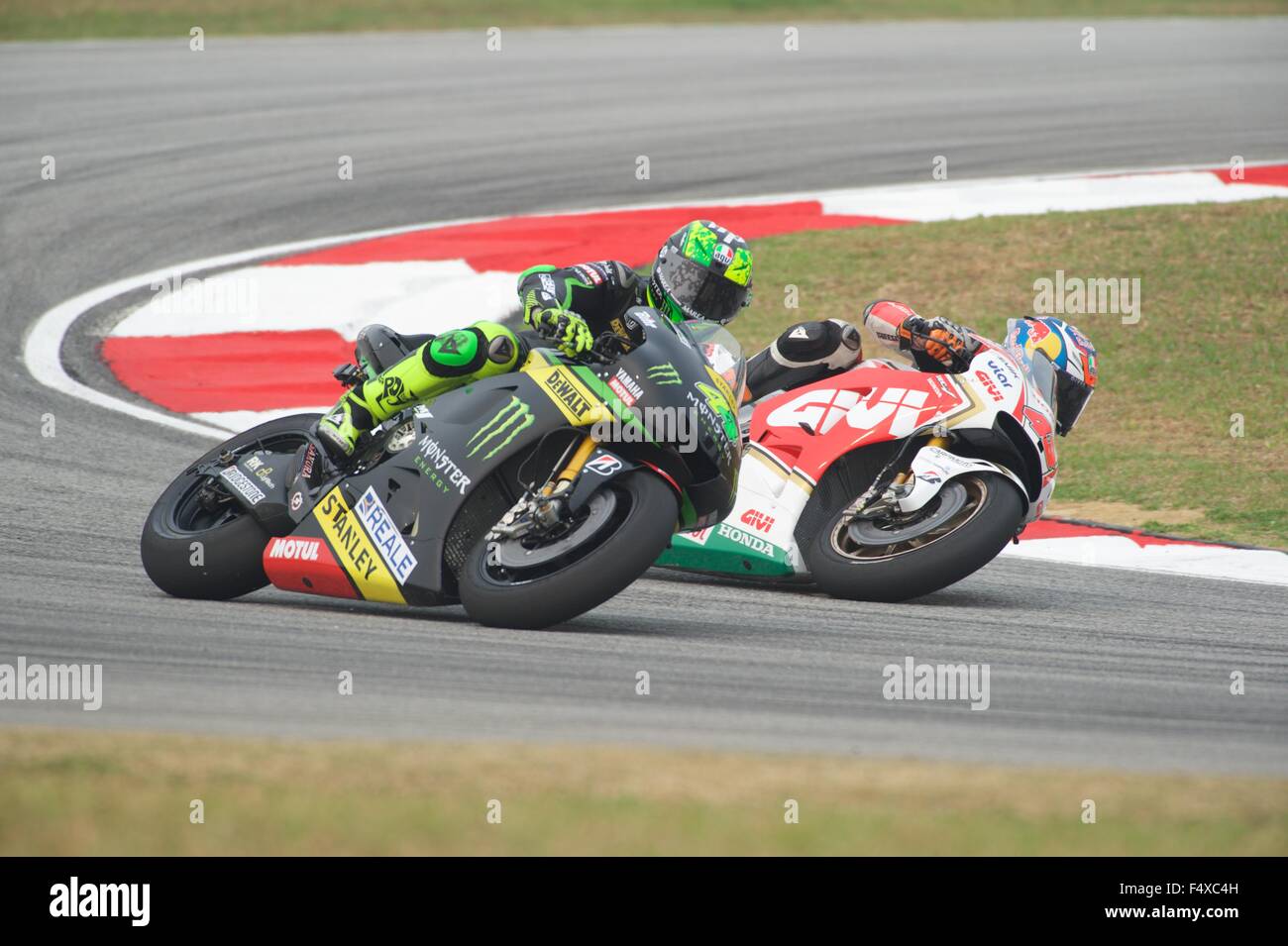 Sepang Circuit, Malaysia. 23rd Oct, 2015. Pol Espargaro and Jack Miller ...