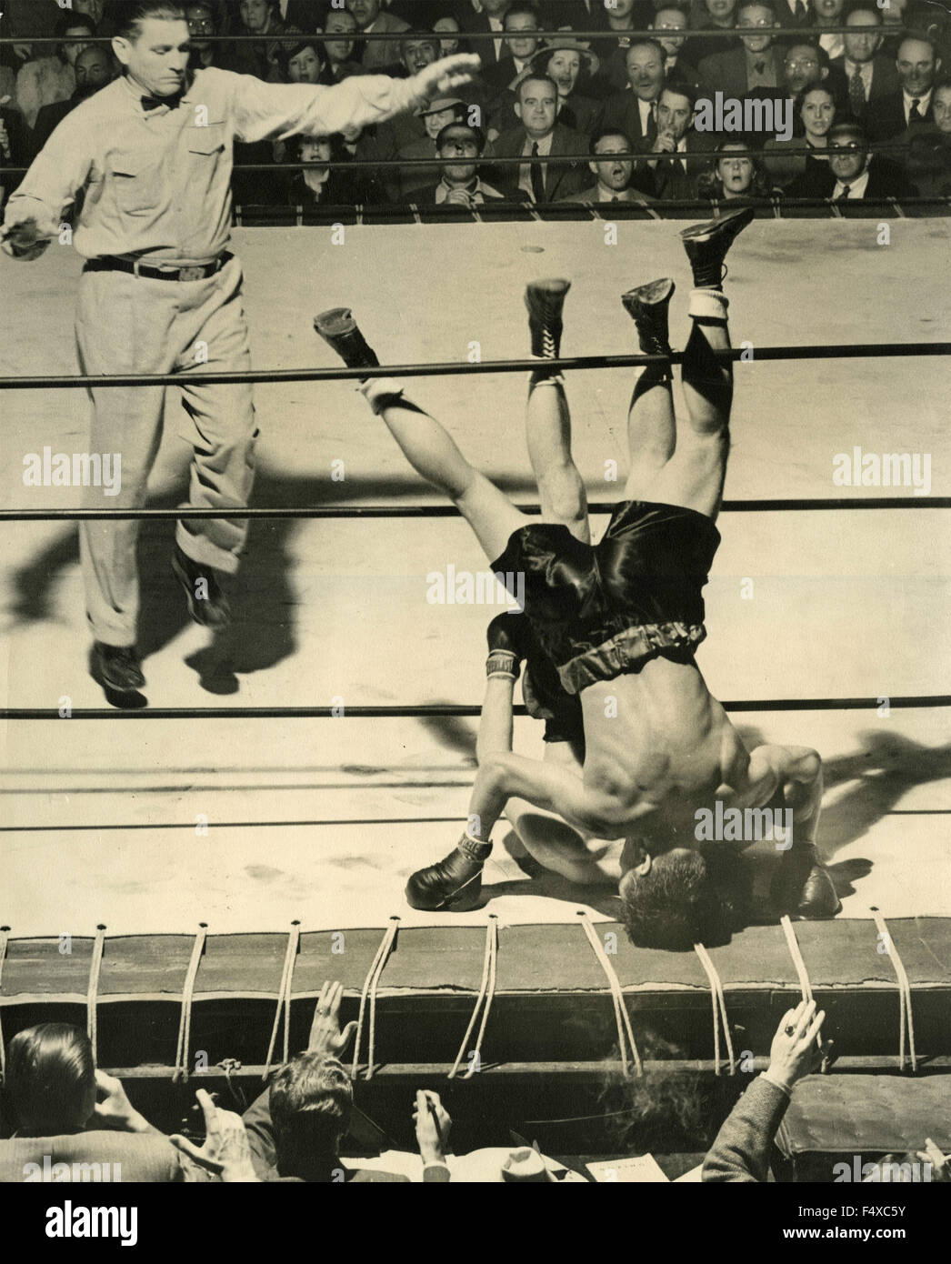 Two boxers both fly out of the ring, USA Stock Photo - Alamy