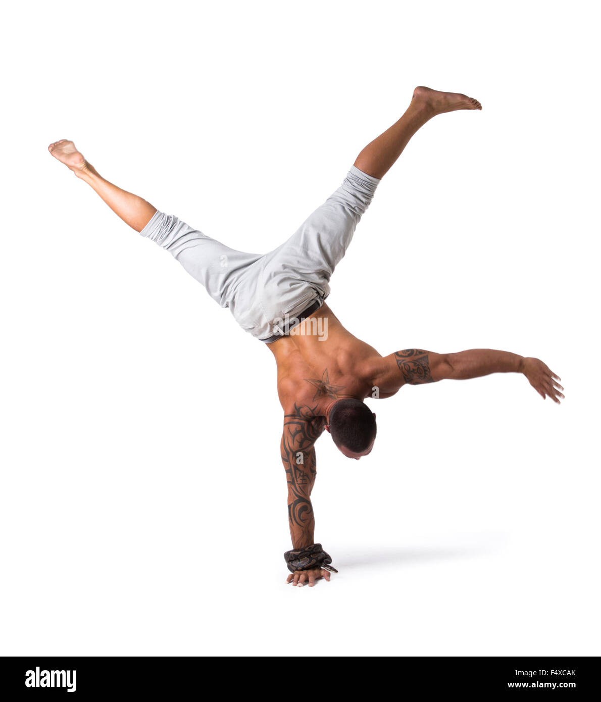 Muscular Shirtless Male Acrobatic Dancer Balancing on Arm and Hand in ...