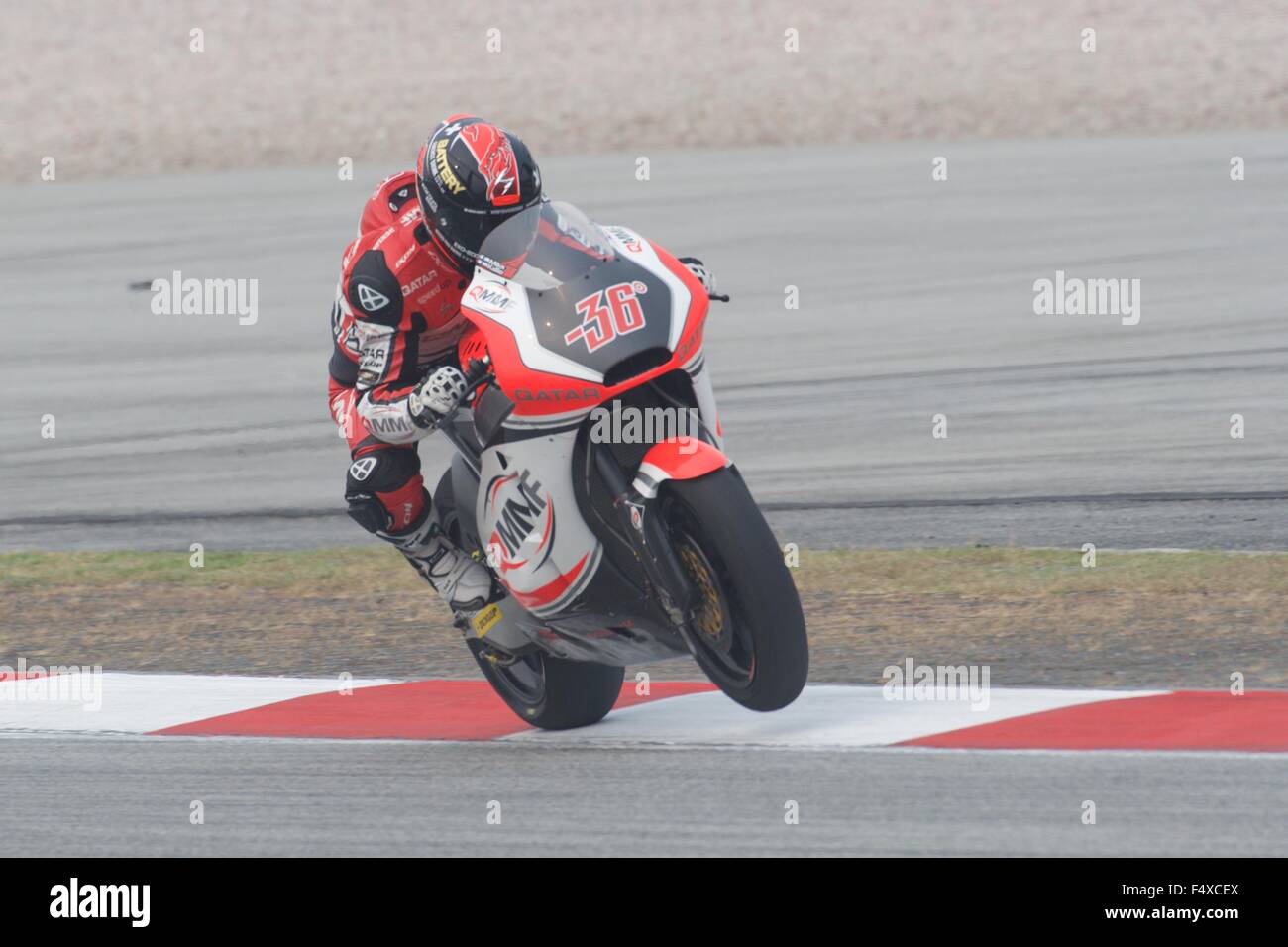 Sepang Circuit, Malaysia. 23rd Oct, 2015. Mika Kallio pulls a wheelie ...