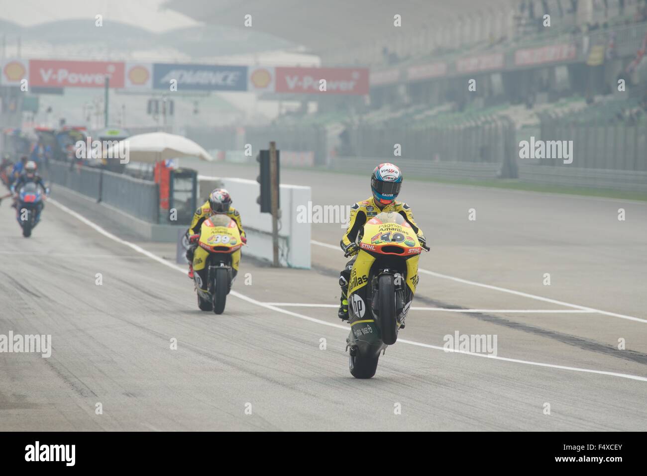 Sepang Circuit, Malaysia. 23rd Oct, 2015. Alex Rins pulls a wheelie ...