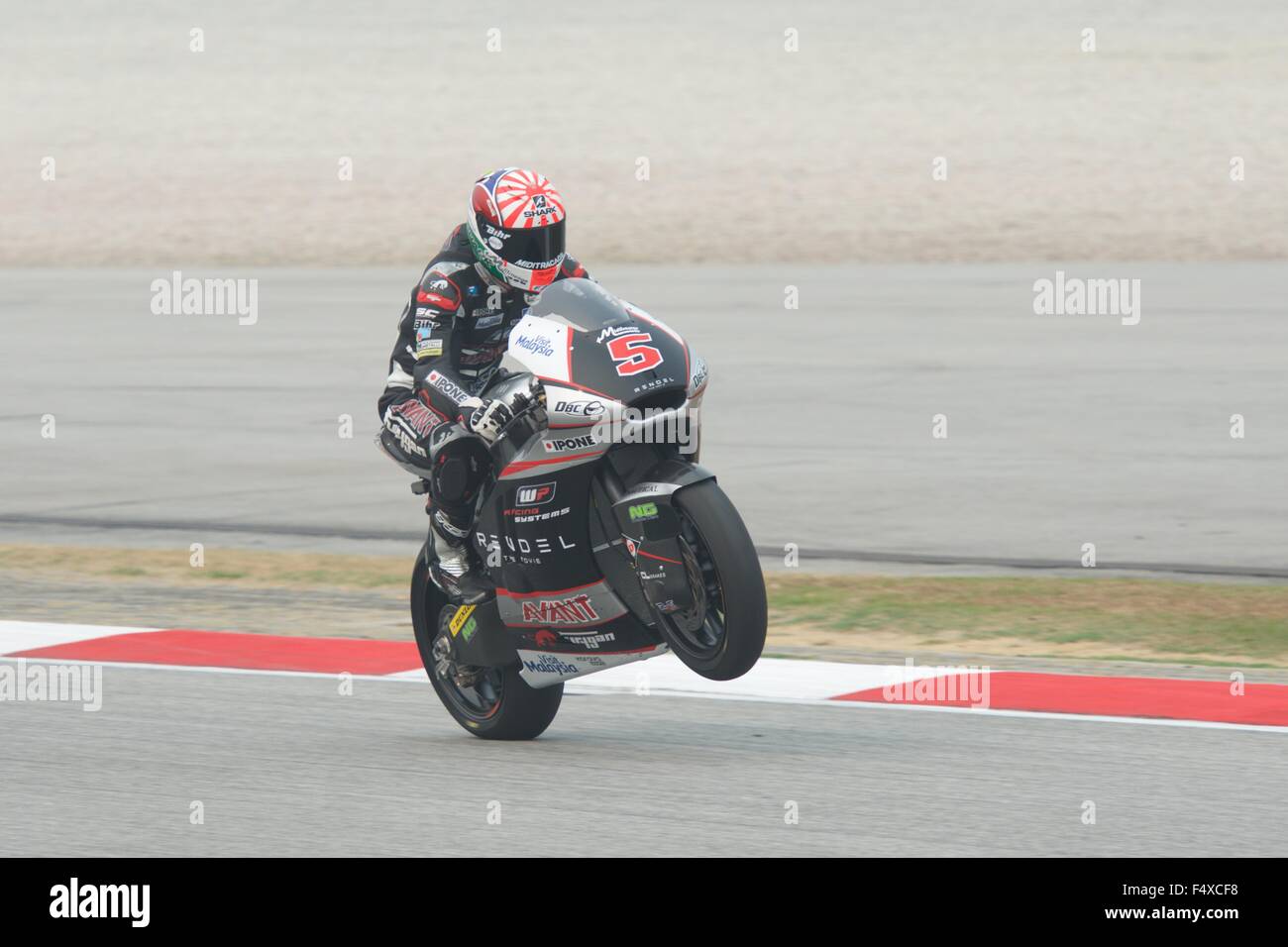 Sepang Circuit, Malaysia. 23rd Oct, 2015. Johann Zarco pulls a wheelie ...