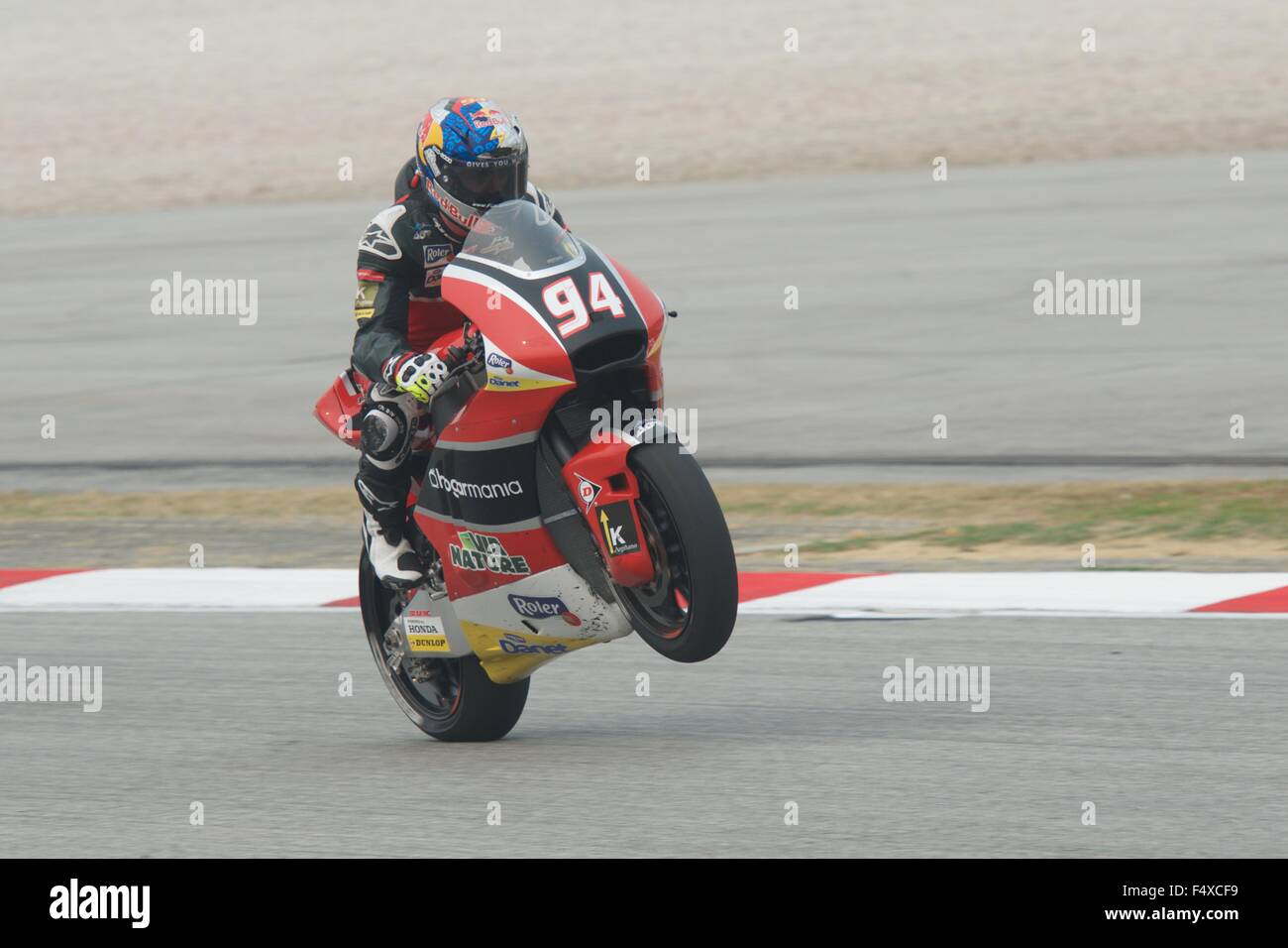 Sepang Circuit, Malaysia. 23rd Oct, 2015. Jonas Folger pulls a wheelie ...