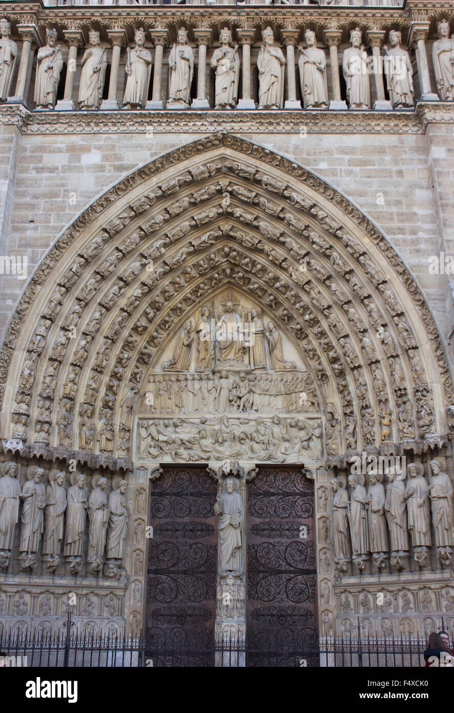 Gothic portal with bas-reliefs over the entrance of Notre Dame ...