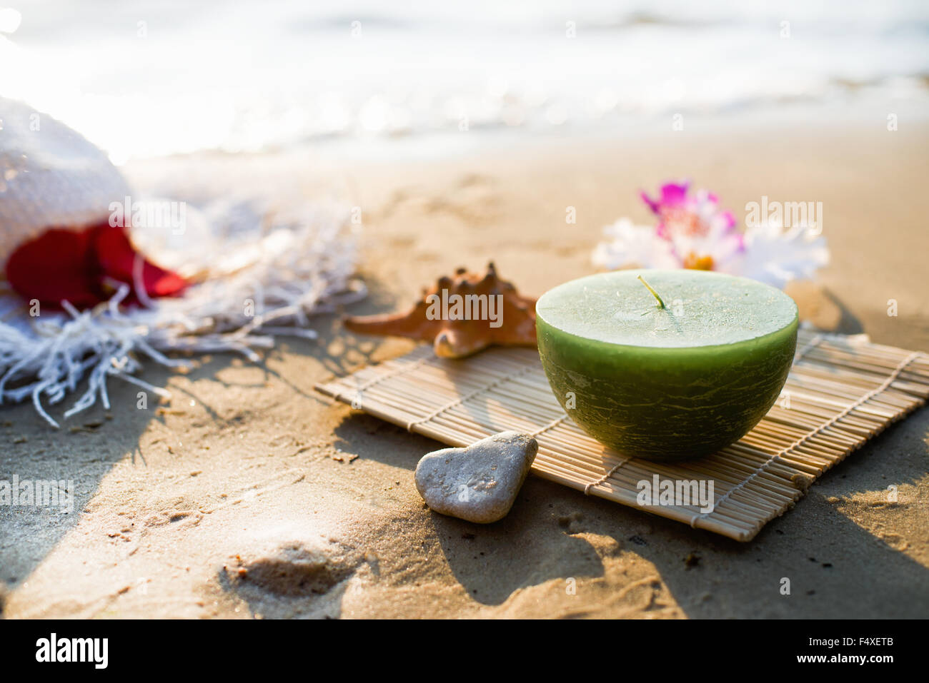 One candle at the sea, spa theme Stock Photo - Alamy