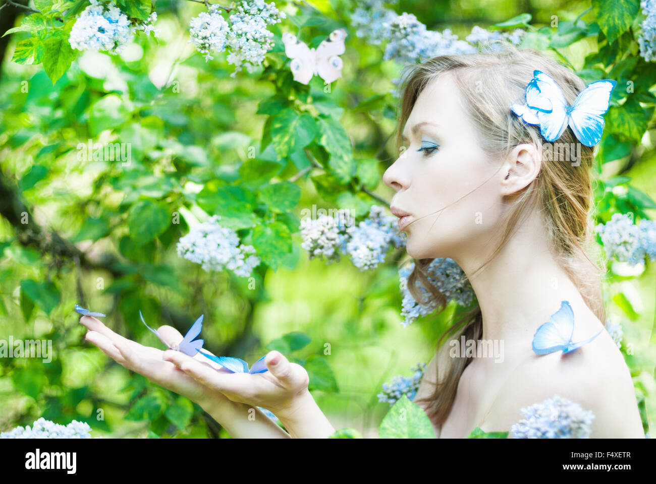 Beautiful Spring Girl with the syringa flowers Stock Photo - Alamy