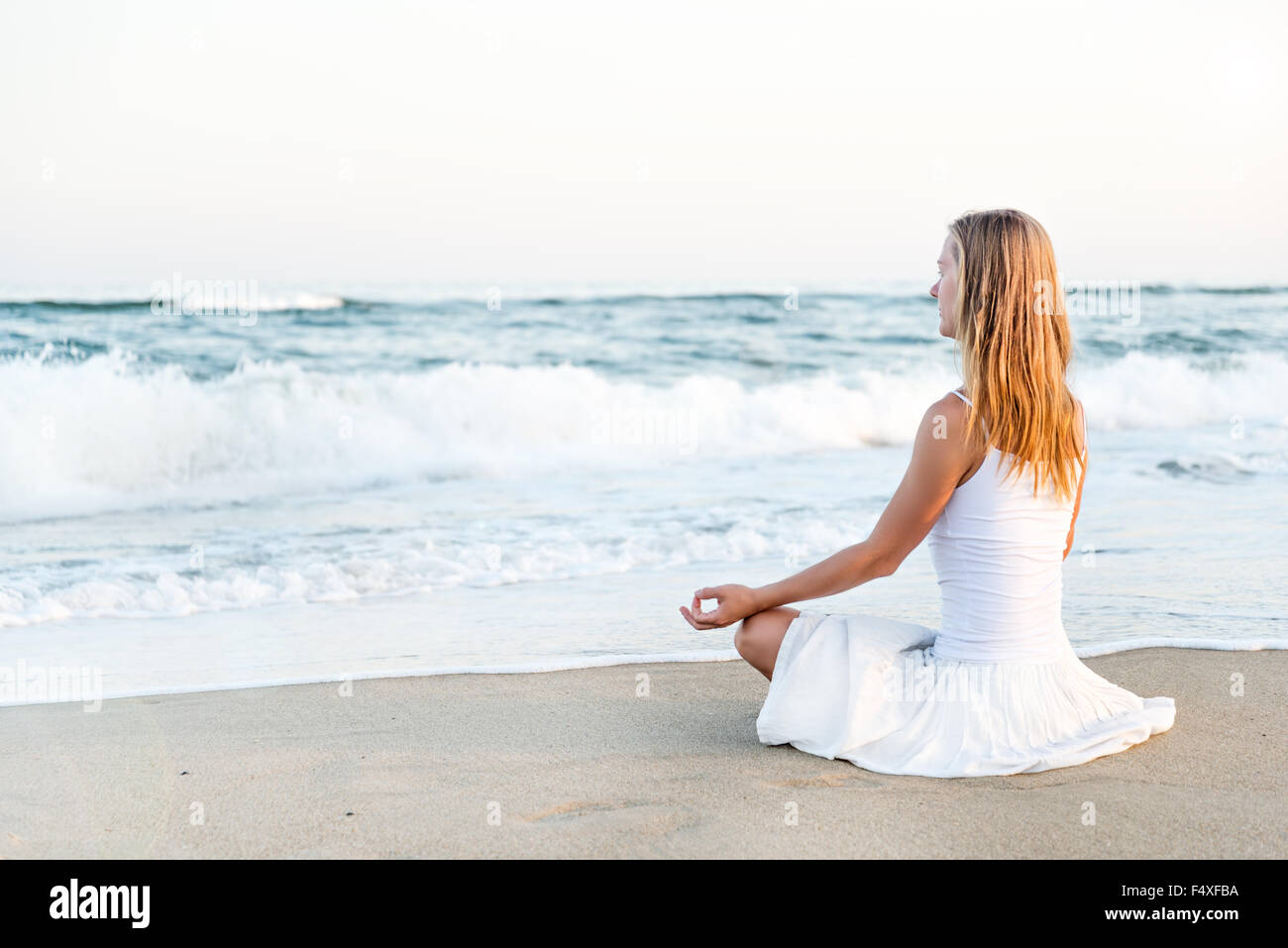 serenity and yoga practicing at the sea Stock Photo - Alamy