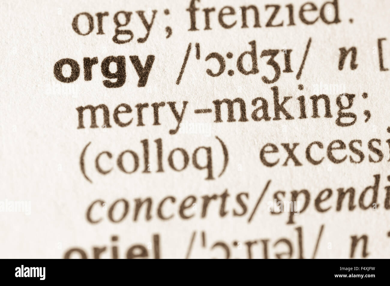 Definition of word orgy in dictionary Stock Photo - Alamy