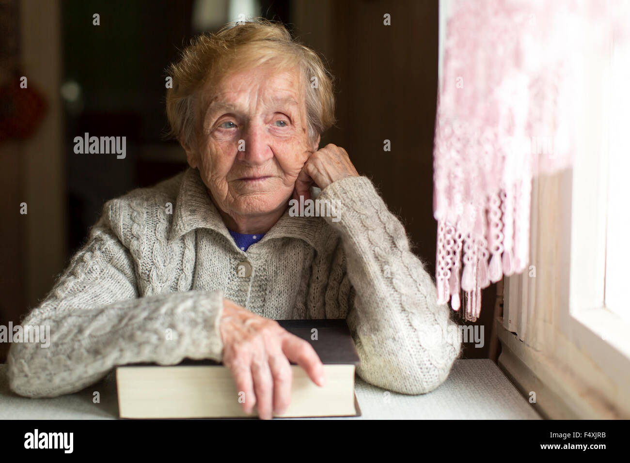 Elderly lady smiling window hi-res stock photography and images - Alamy
