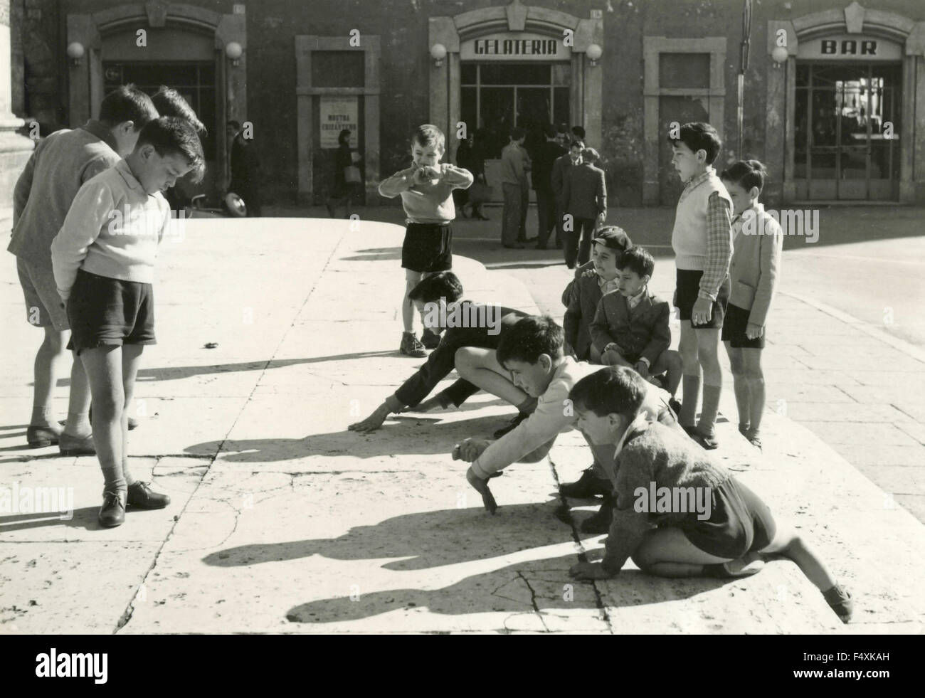 Playing marbles 1950's hi-res stock photography and images - Alamy