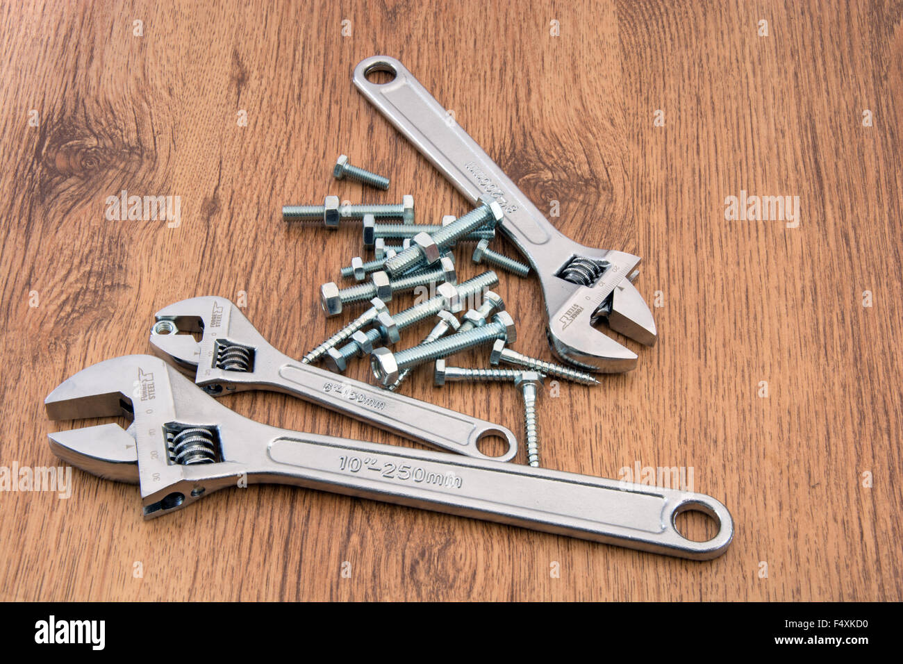 Adjustable wrenches with nuts and bolts Stock Photo - Alamy