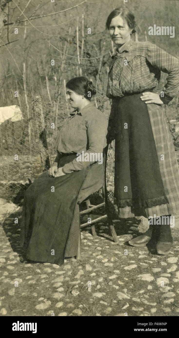Two women from the countryside into the garden, Italy Stock Photo - Alamy