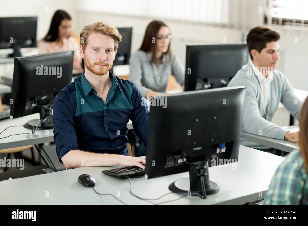Young people in the classroom Stock Photo - Alamy