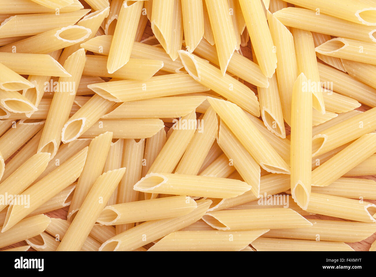 background the texture of raw pasta closeup Stock Photo - Alamy