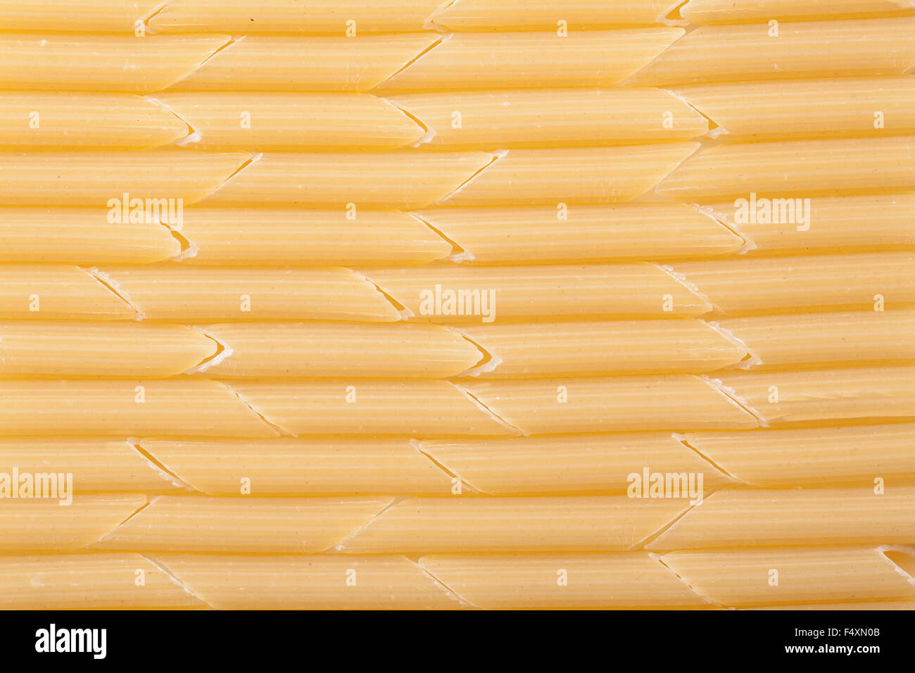 background the texture of raw pasta closeup Stock Photo - Alamy