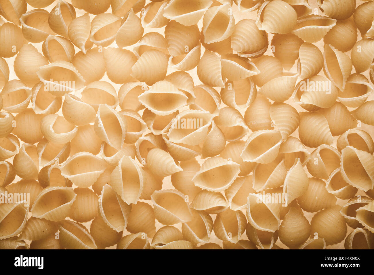 background the texture of raw pasta closeup Stock Photo - Alamy