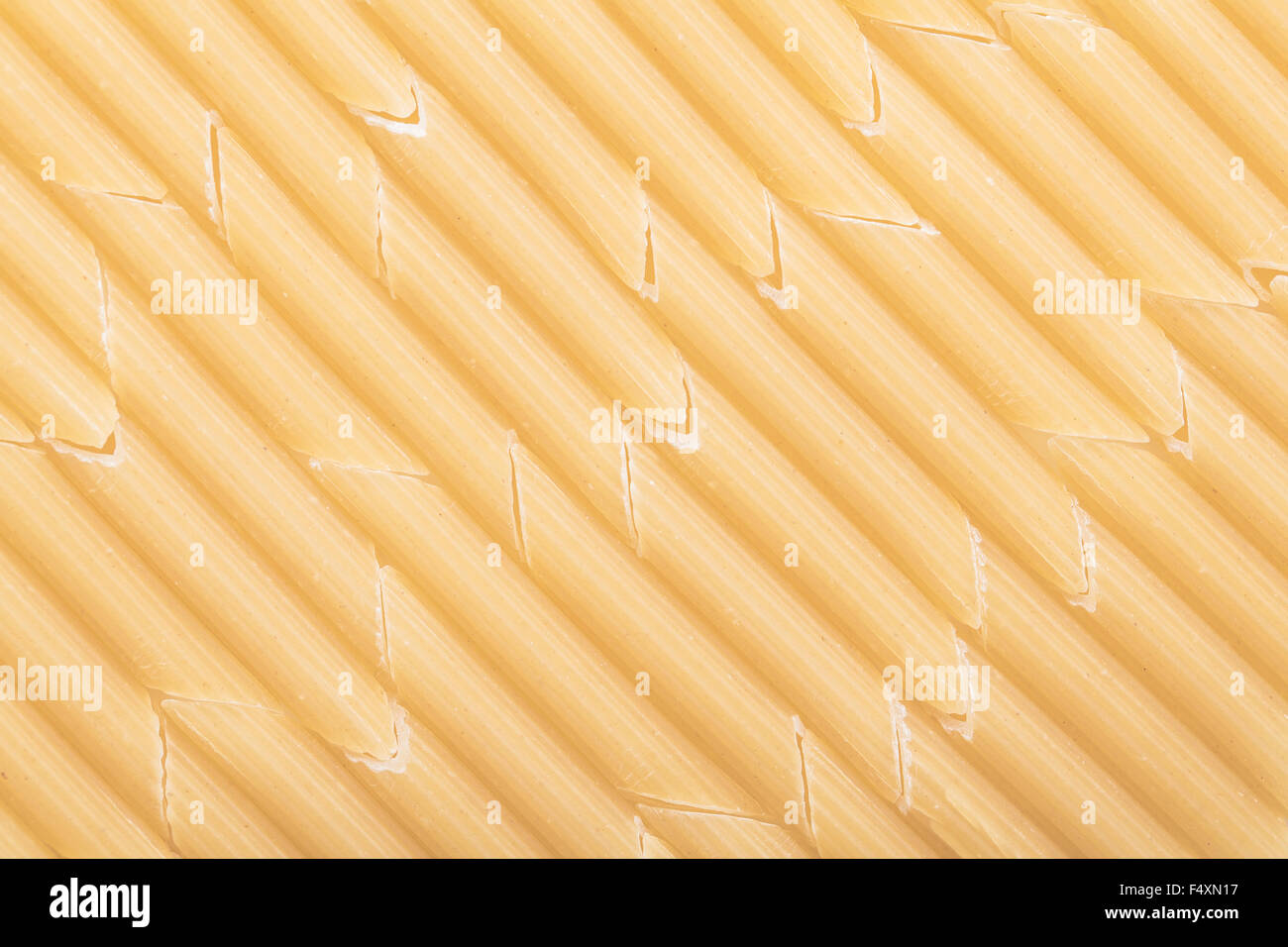 background the texture of raw pasta closeup Stock Photo - Alamy