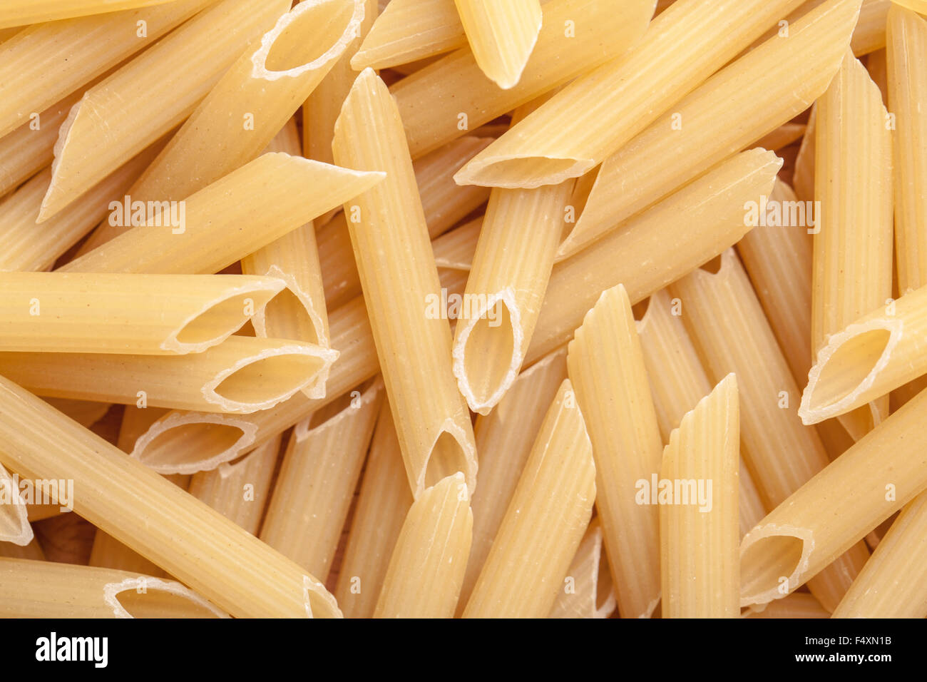 background the texture of raw pasta closeup Stock Photo - Alamy