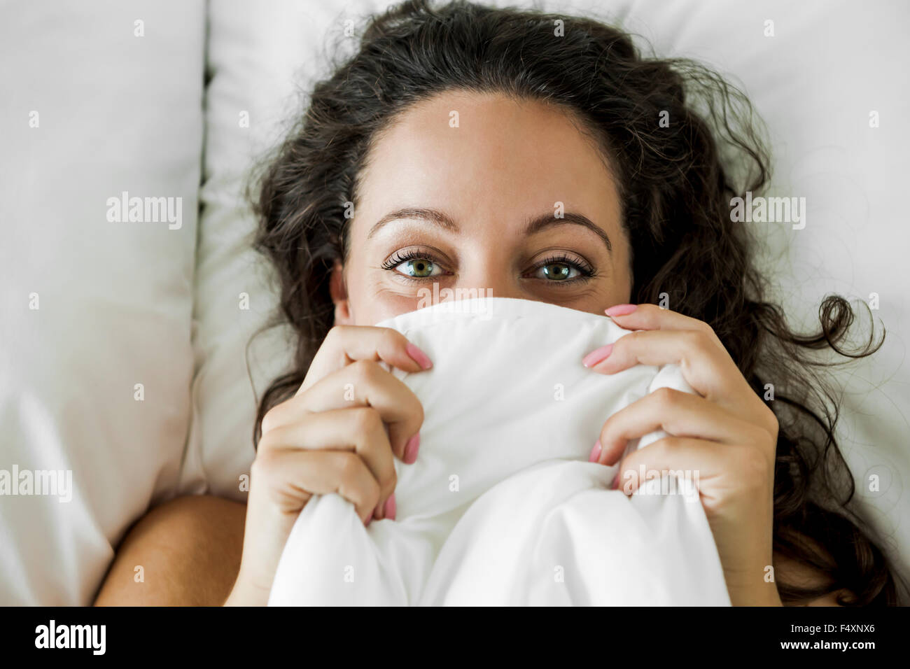 Beautiful woman in the bed and smiling by the morning Stock Photo - Alamy