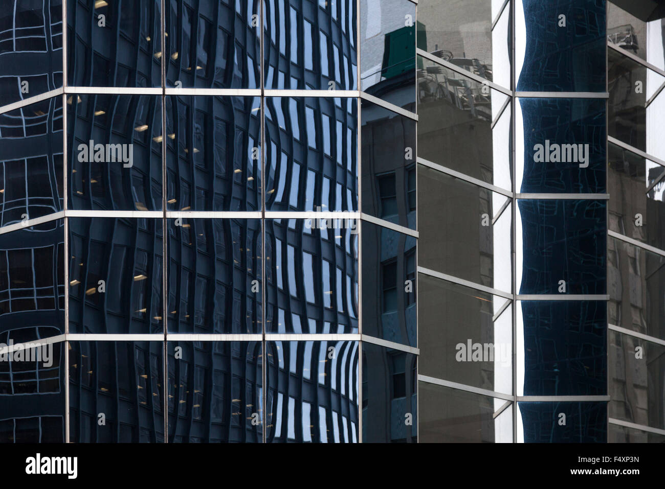 glass facade of skyscraper in new york downtown manhattan with almost ...