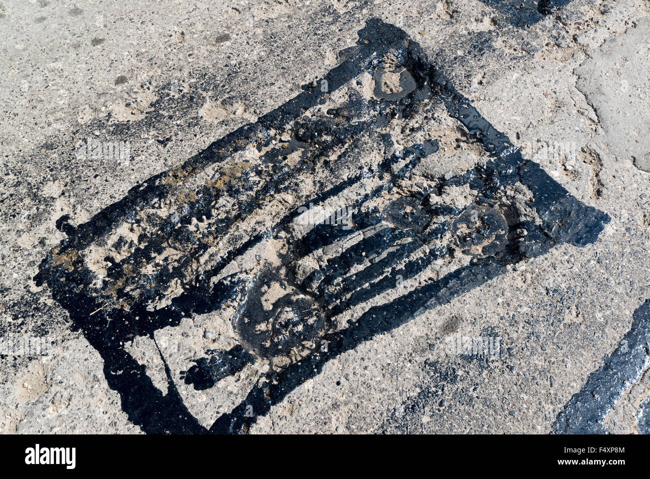 Road repair. Hole in asphalt and bitumen Stock Photo - Alamy