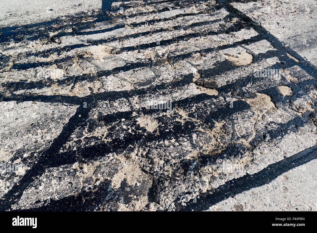 Road repair. Hole in asphalt and bitumen Stock Photo - Alamy