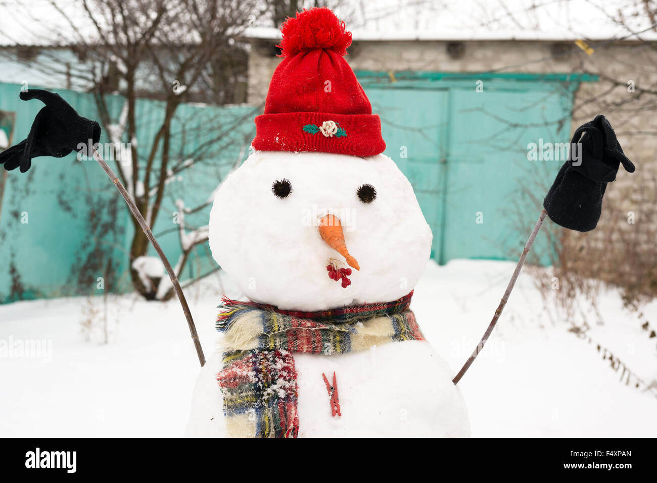 Snowman in a red cap Stock Photo - Alamy