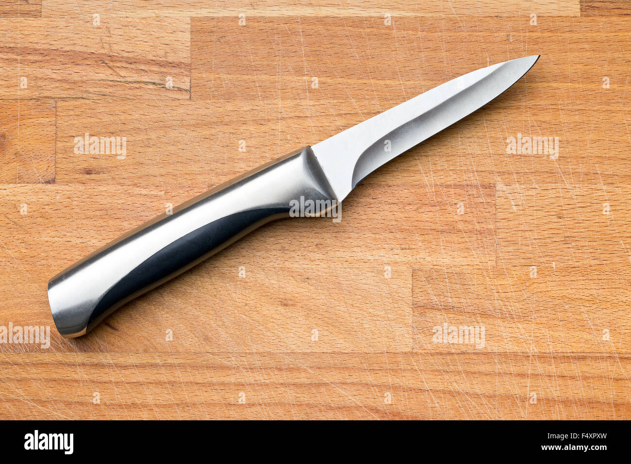 the kitchen knife on wooden table Stock Photo - Alamy