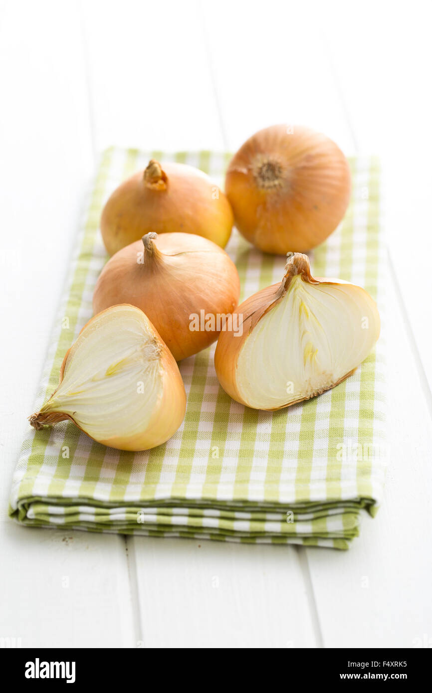 halved fresh onion on a kitchen table Stock Photo - Alamy